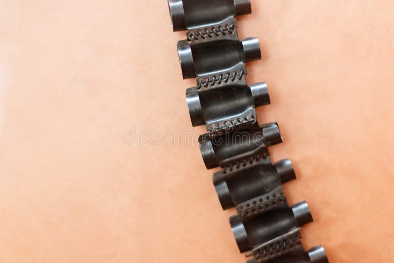 Empty Machine Gun Tape without Ammunition on a Wooden Box with Weapons ...