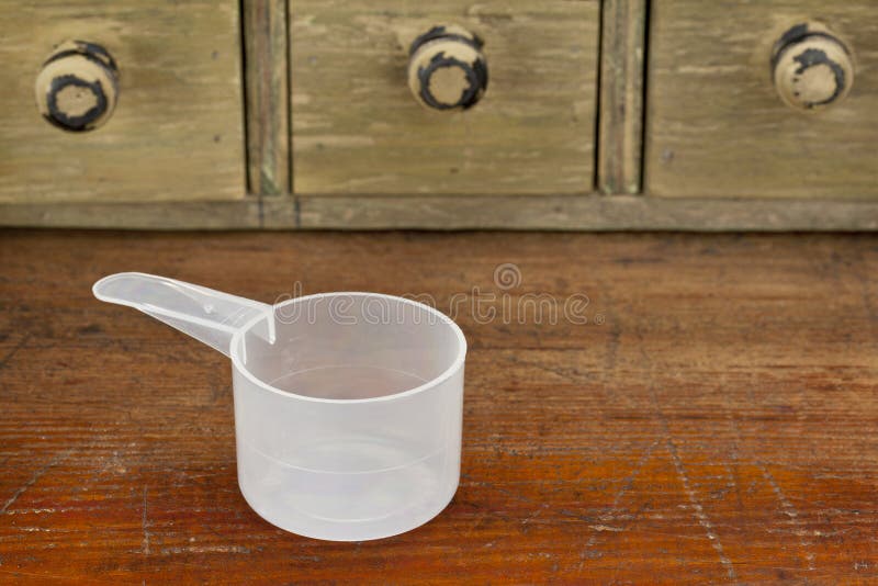 Empty measuring cup stock image. Image of scratched, wood - 24901775