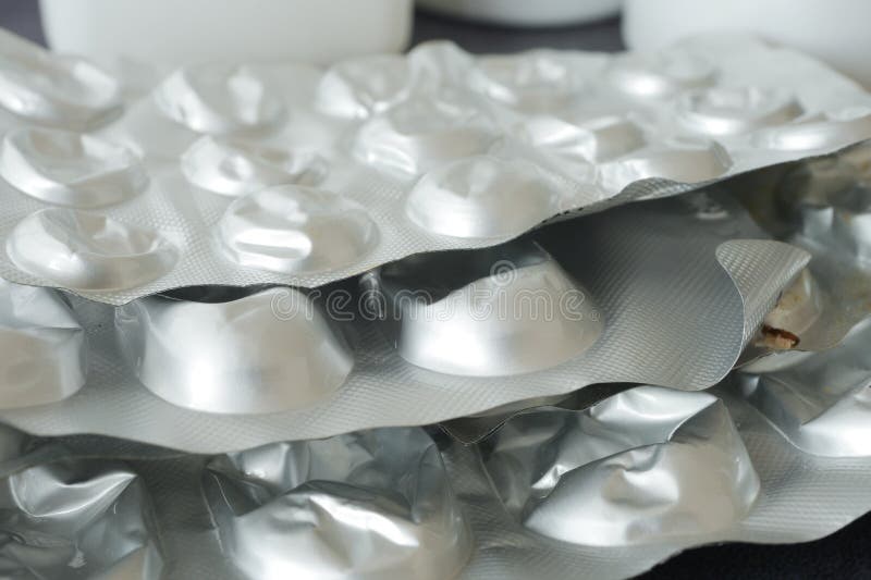 Empty Medication Blister Packs Stacked on a Table Stock Photo - Image ...