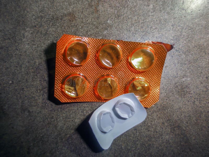 Empty Medicine Foil Packs on a Table and Pair of Hands Stock Photo ...