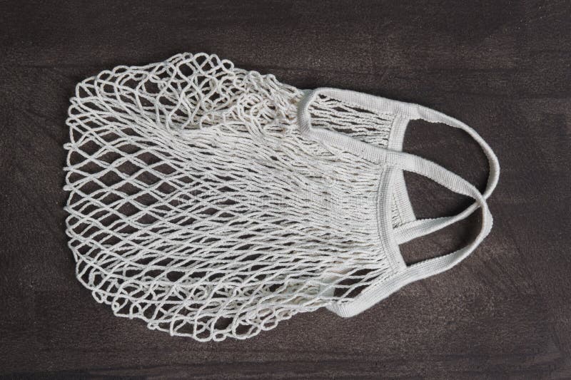 Empty Mesh Bag for Shopping on a Grey Background. Zero Waste Shopping ...