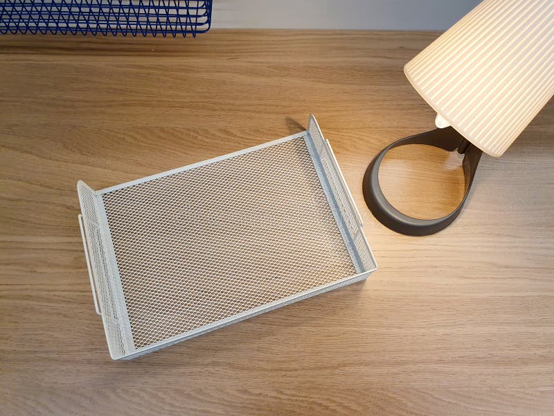Empty Mesh Metal Paper Tray and Table Lamp on Table. Workplace Concept ...