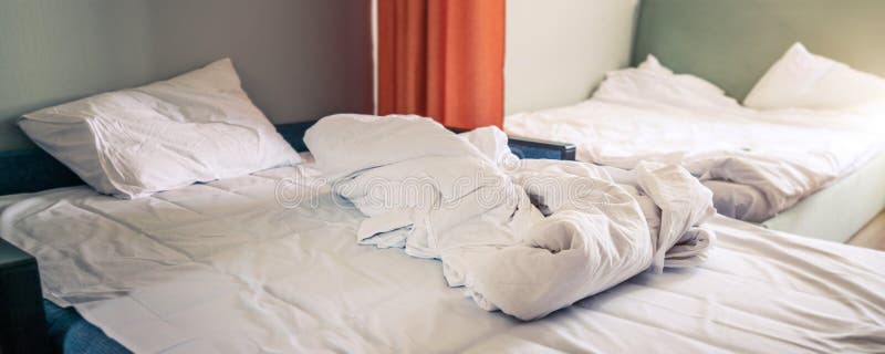 Empty Messy Untidy Bed with White Linen at Morning Time Stock Photo ...
