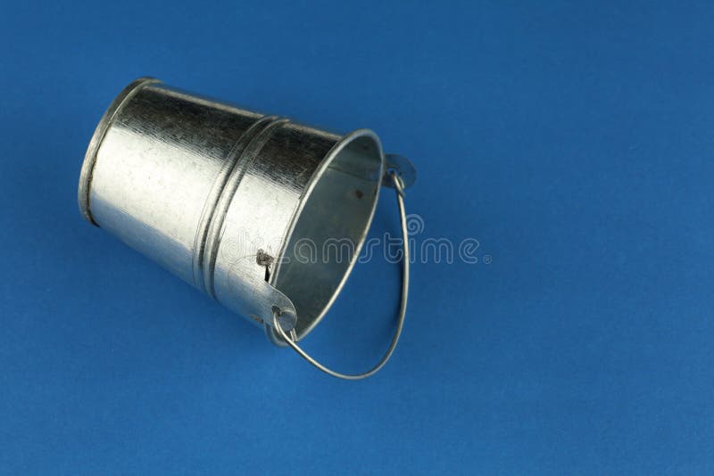 Empty Metal Bucket on a Blue Background Stock Image - Image of white ...