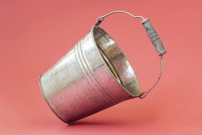 Empty Bucket Falling on Pink Background Stock Photo - Image of zink ...