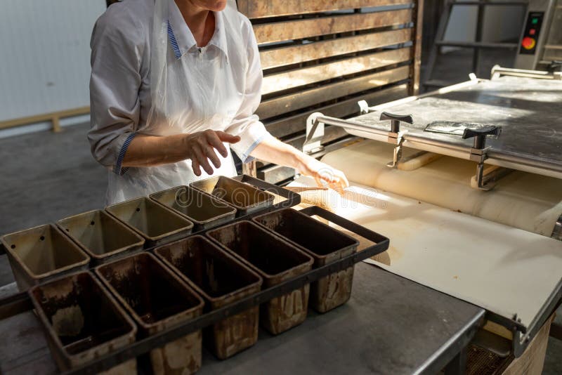 Empty Metal Molds for Baking Bread on the Table in Front of the Baker ...