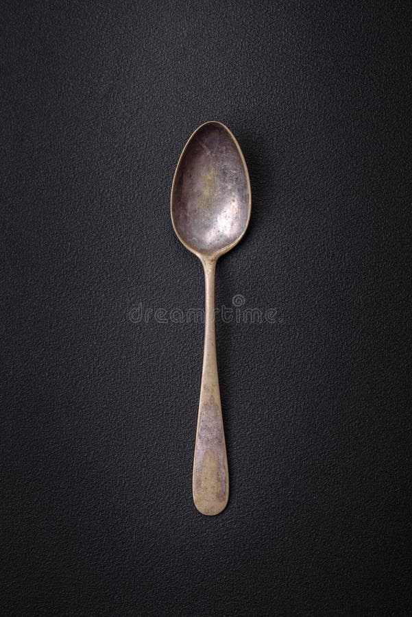 Empty Metal Spoon on Dark Textured Concrete Background Stock Image ...