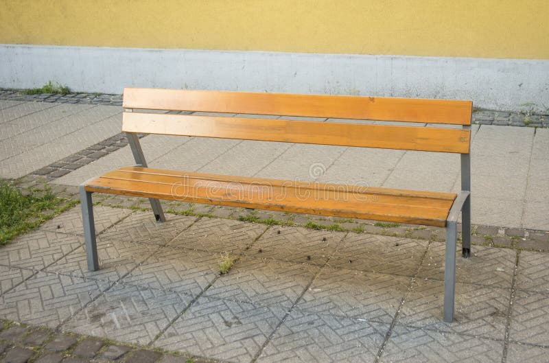 Empty Metal and Wooden Bench in the Town. Stock Photo - Image of ...