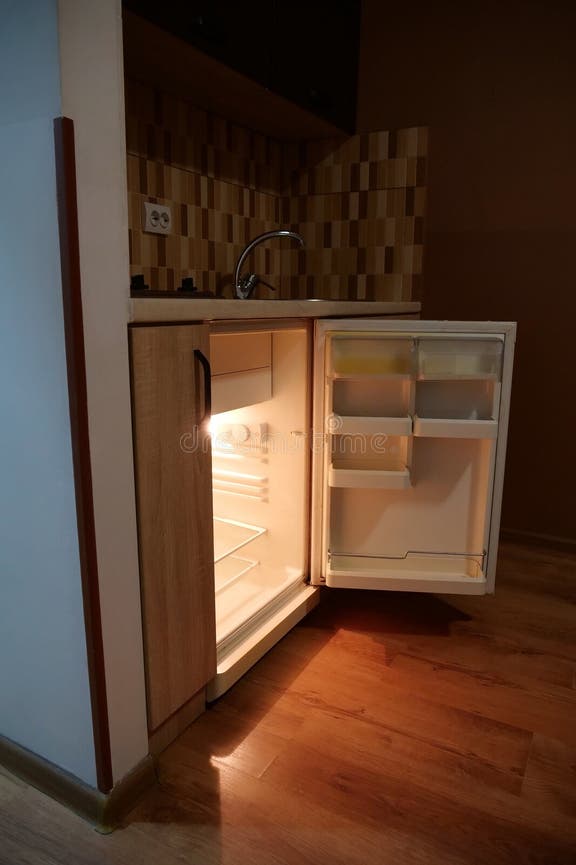 Empty Mini Fridge with Open Door in Kitchen Stock Image - Image of ...