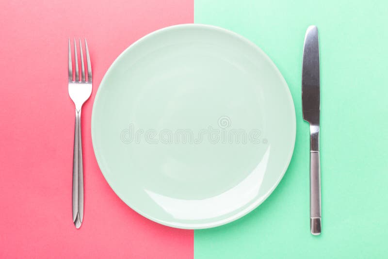 Empty Mint Plate, Knife and Fork on Colored Paper Background Copy Space ...