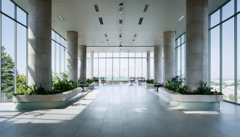 An Empty Modern Office Building Interior with Concrete Pillars, Benches ...