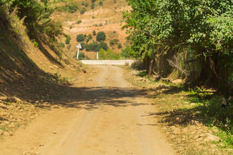 An Empty Mountain Road with an Orange Sandy Color of the Ground, Soil ...