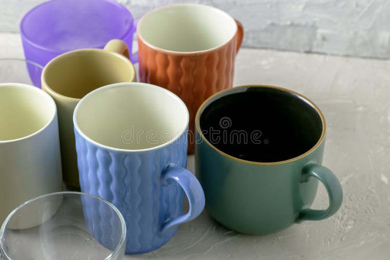 Empty Mugs of Different Shapes and Sizes on the Table Stock Photo ...