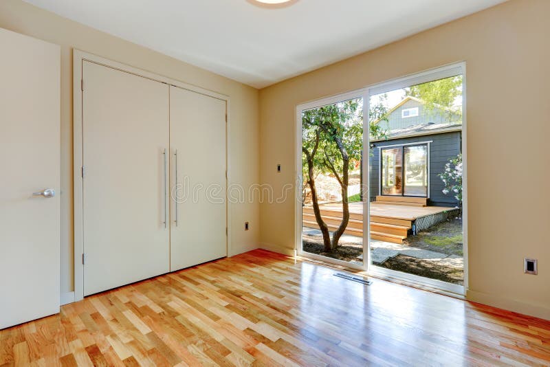 Empty Nice Room with Hardwood Floor and Large Doors. Stock Image ...