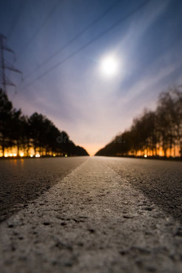 Empty Night Asphalt Road, Bright Full Moon Behind Clouds and City Light ...