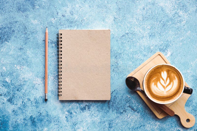 Empty Notebook with Cup of Coffee Latte on Blue Abstract Background ...