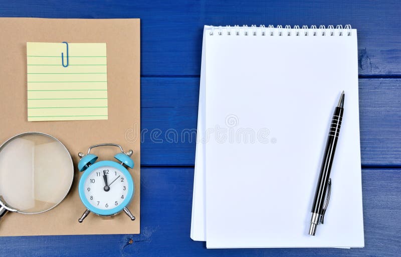 Empty Notepad Page with Alarm Clock and Magnifying Glass Stock Image ...