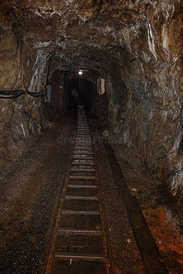 Empty Old Abandoned Mine Shaft with Rusty Railway Stock Photo - Image ...
