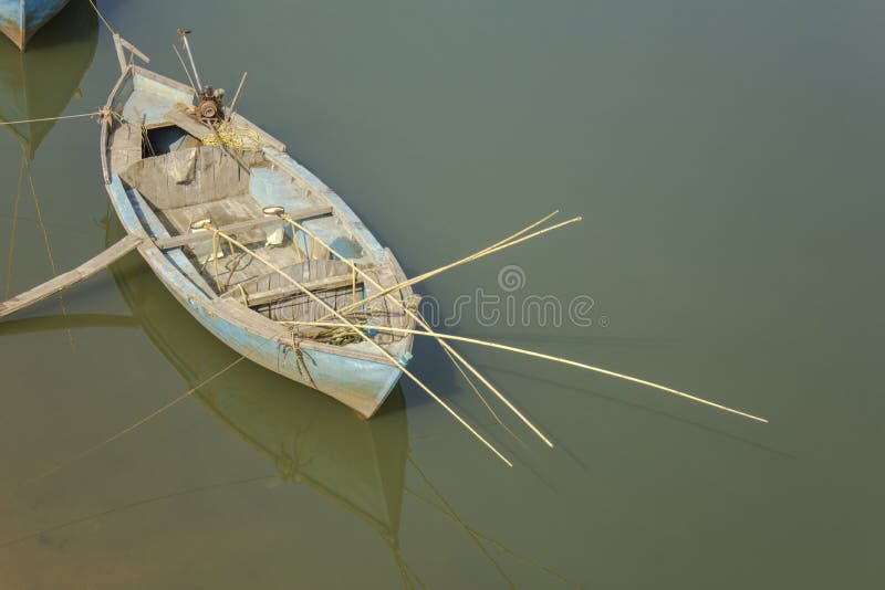 Empty Old Blue Wooden Fishing Boat on a Smooth Water Surface Stock ...