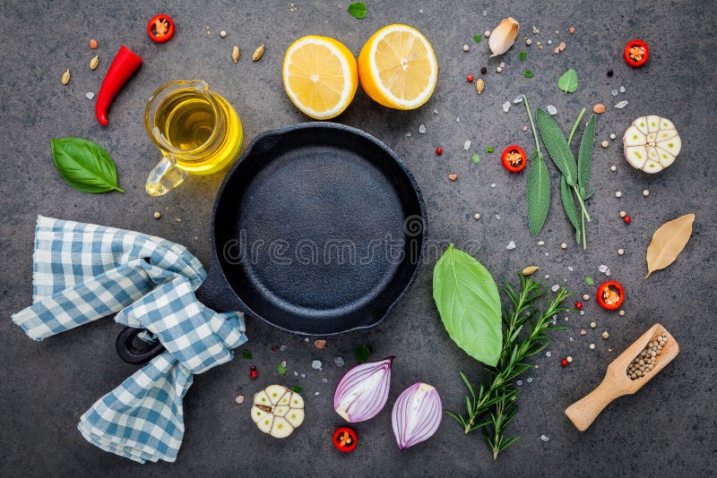 Empty Old Cast Iron Skille on Dark Stone Background. Ingredients Stock ...