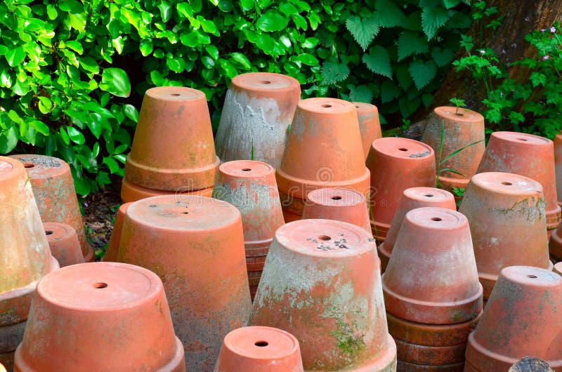 Empty Old Clay Ceramic Flower Pot Piles. Piles of Old Flower Pots in a ...