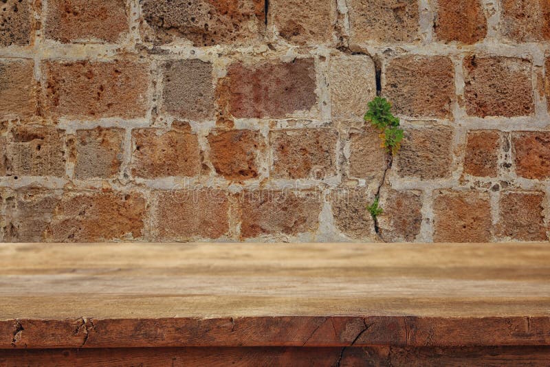 Empty Old Table In Front Of Ancient Wall Of Stones. Useful For Product ...