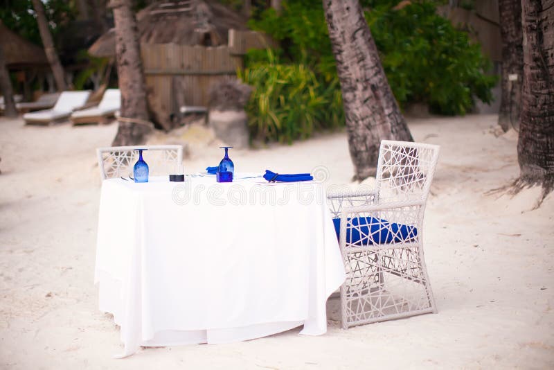 Empty Open Air Table Set for Dinner on White Beach Stock Photo - Image ...