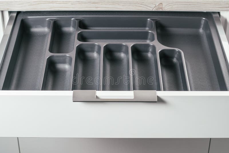 Empty Open Drawer of White Kitchen Set with Black Cutlery Organizer ...
