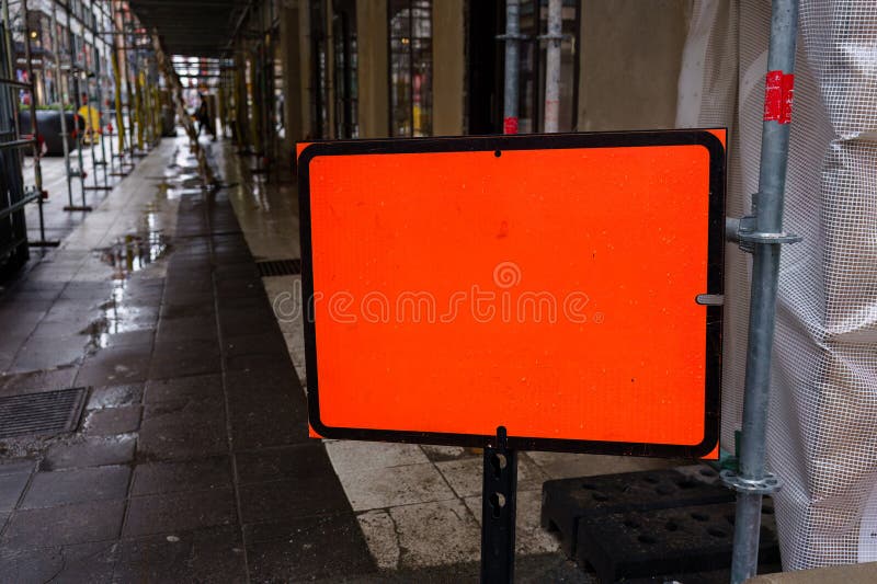 Empty Orange Construction Sign on Sidewalk Stock Photo - Image of ...