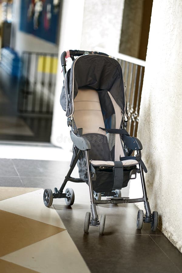Empty Ordinary Stroller on Hall Walkway Stock Photo - Image of child ...