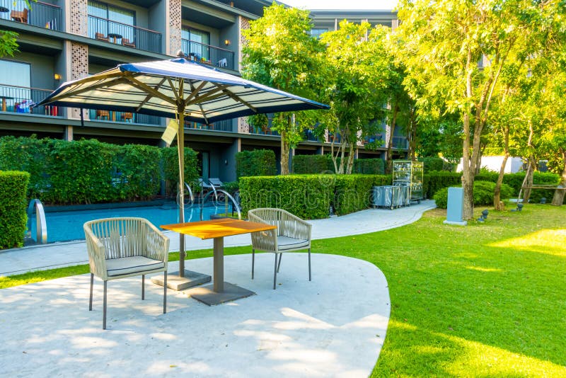 Empty Outdoor Patio Chair in Garden Stock Photo - Image of cozy ...