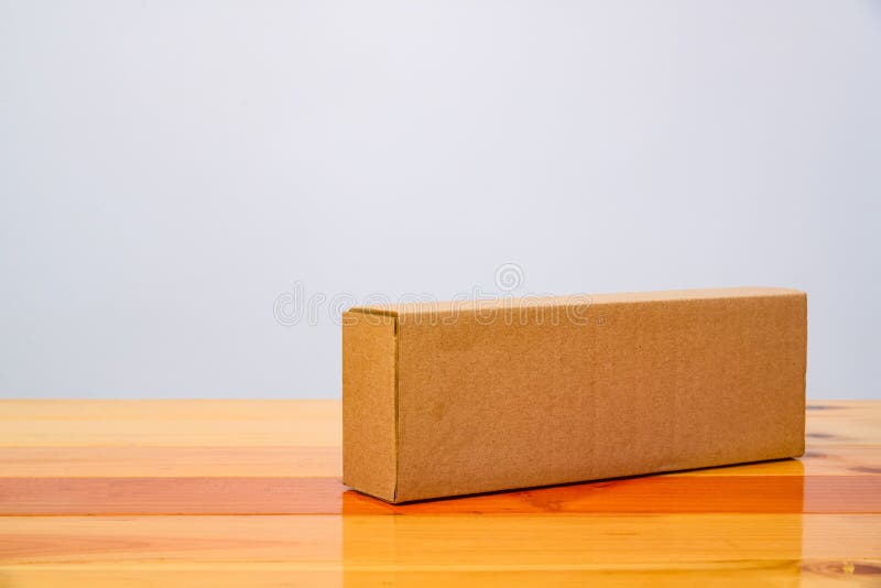 Empty Package Brown Cardboard Box for Long Items on Wooden Table Stock ...