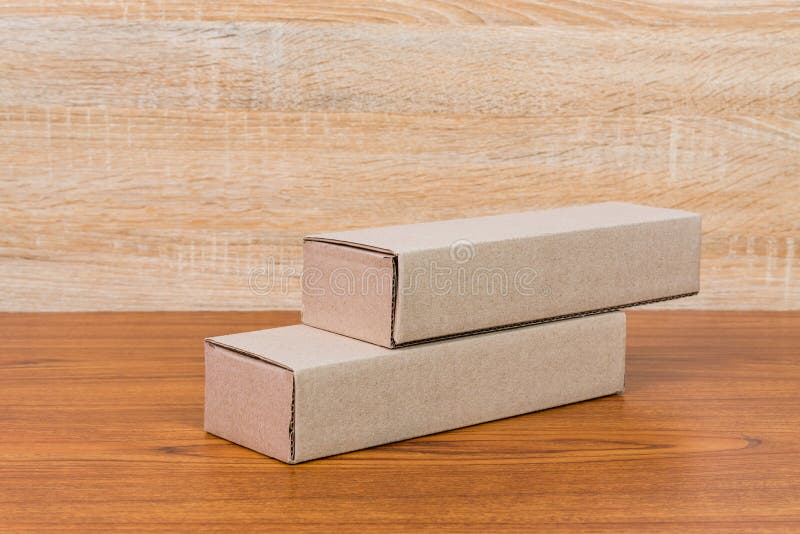 Empty Package Brown Cardboard Box for Long Items on Wooden Table Stock ...