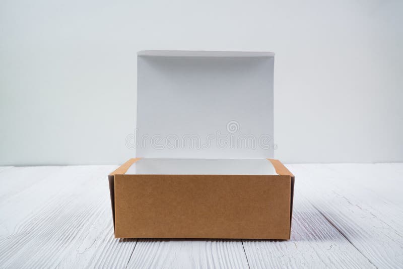 Empty Package Brown Cardboard Box or Tray on Bright Wooden Table Stock ...