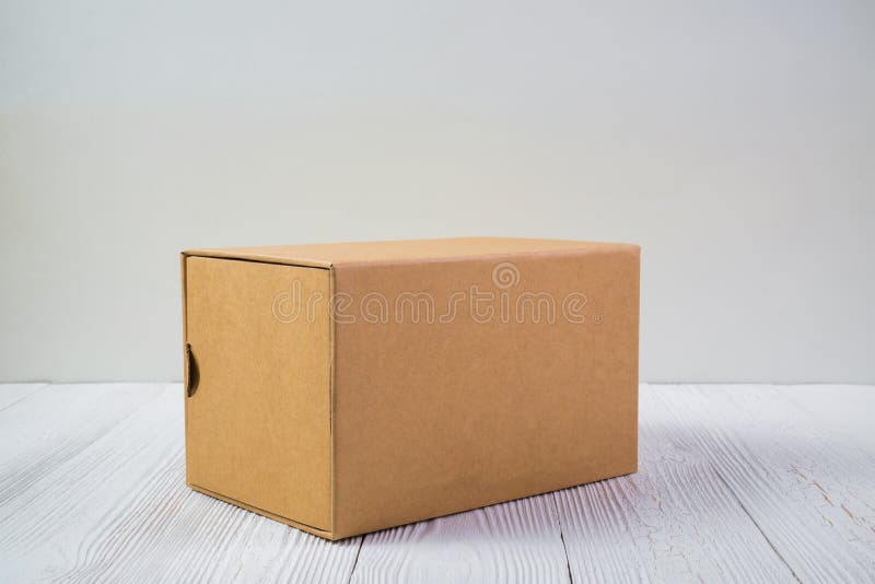 Empty Package Brown Cardboard Box or Tray on Bright Wooden Table Stock ...