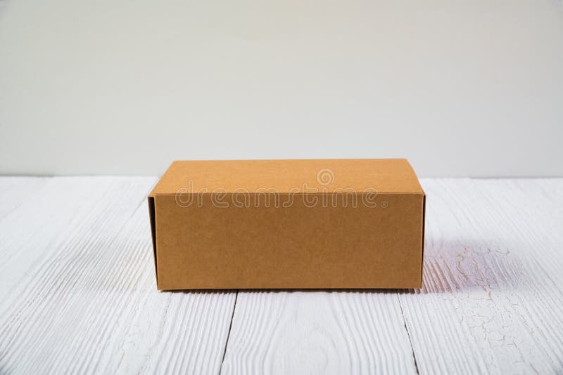 Empty Package Brown Cardboard Box Or Tray On Bright Wooden Table Stock ...