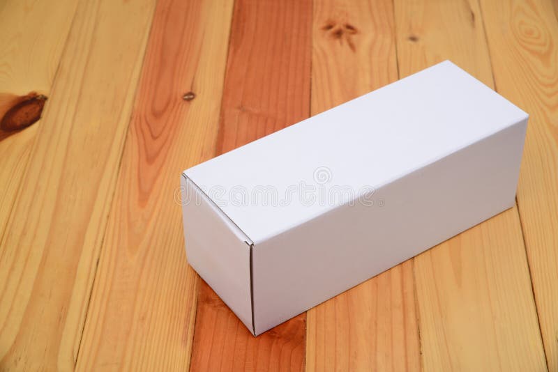 Empty Package White Cardboard Box for Long Items on Wooden Table Stock ...