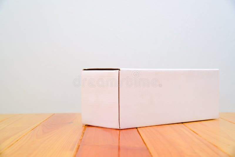 Empty Package White Cardboard Box for Long Items on Wooden Table Stock ...