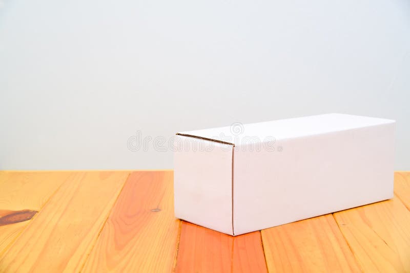 Empty Package White Cardboard Box for Long Items on Wooden Table Stock ...