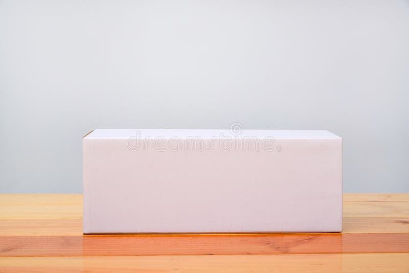Empty Package White Cardboard Box for Long Items on Wooden Table Stock ...