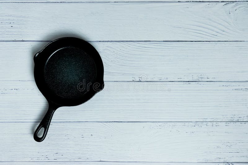An Empty Pan Resting on a White Wooden Floor Stock Image - Image of ...