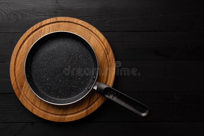 Empty Pan on Wood Board. Empty Marble Coated Iron Pot Stock Photo ...