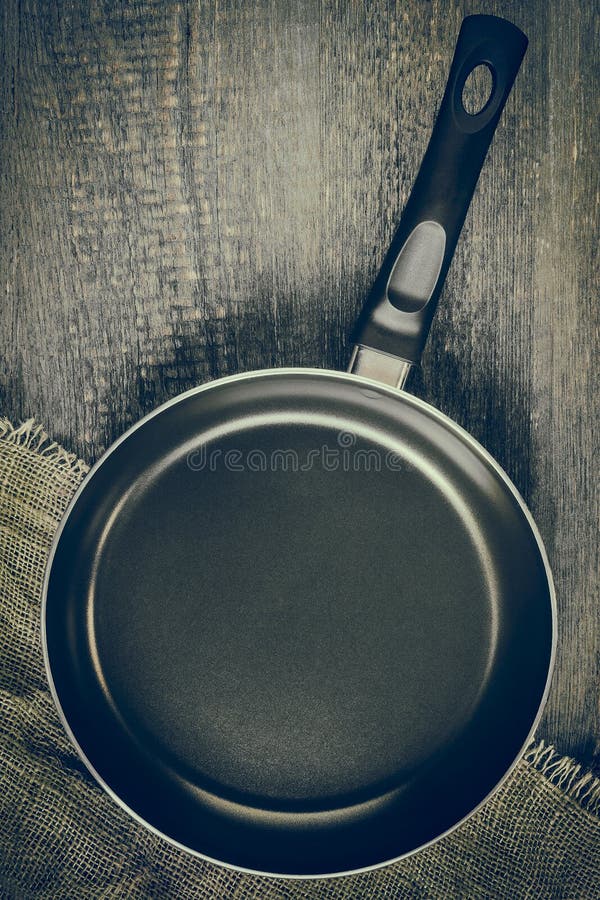 An Empty Pan on a Wooden Table Stock Photo - Image of empty, cooking ...