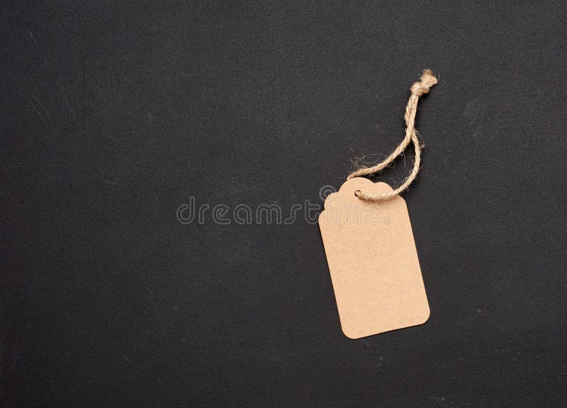 Empty Paper Brown Rectangular Price Tag on a Rope on a Black Background ...