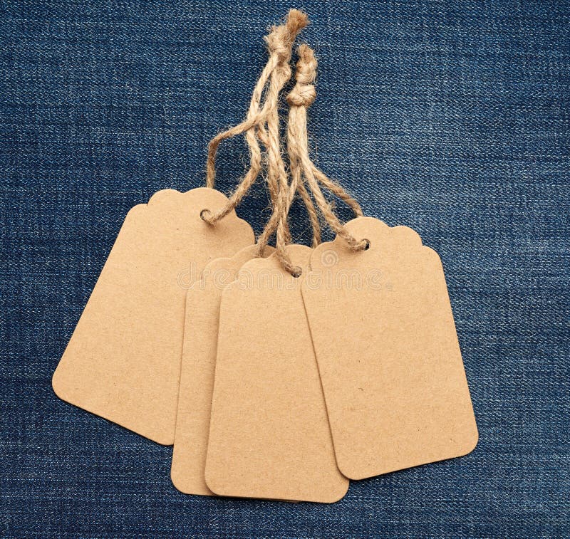 Empty Paper Brown Rectangular Price Tag on a Rope on a Black Background ...