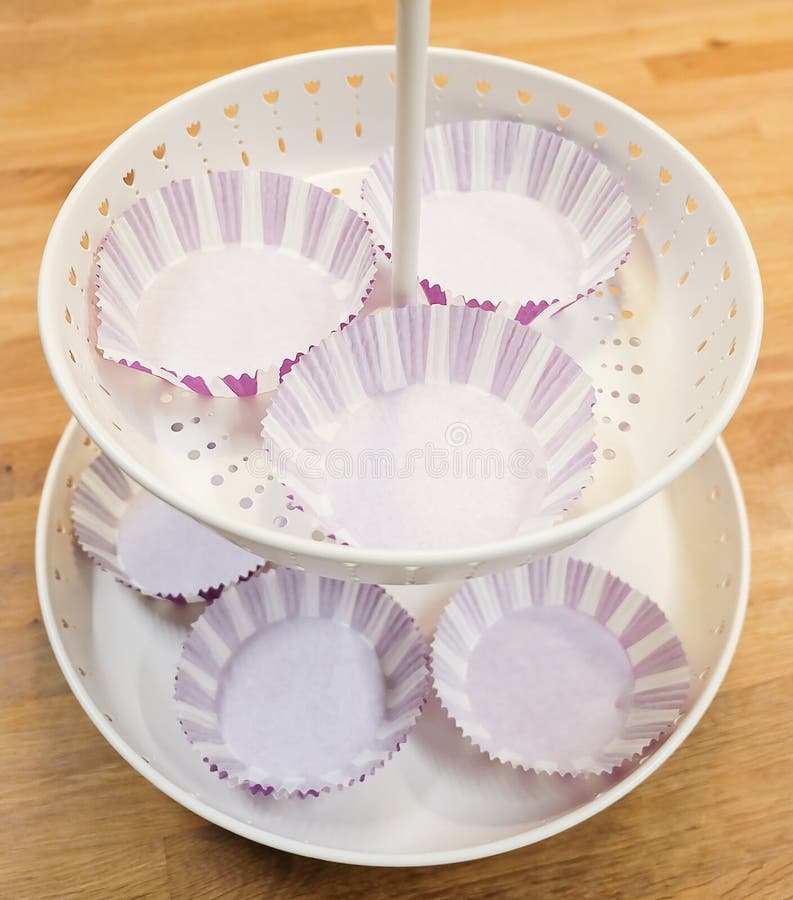 Empty Paper Cupcake Cups on a Pedestal Tray Stock Photo - Image of ...