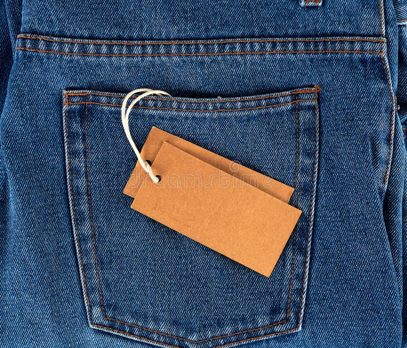 Empty Paper Tag on a Rope Tied To Blue Jeans Stock Image - Image of ...