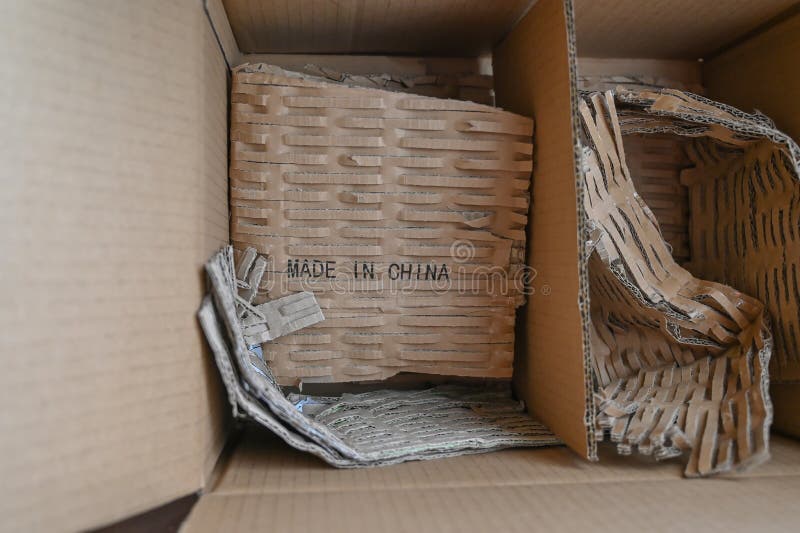 Empty Parcel Box with Filler. the Inscription MADE in CHINA Stock Photo ...