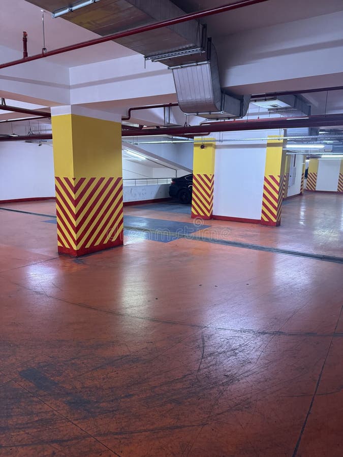 Empty Parking Garage with Striped Columns Stock Photo - Image of ...