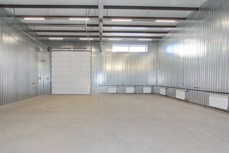 Empty Parking Garage, Warehouse Interior with Large White Gates and ...